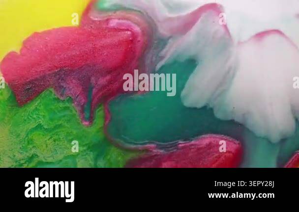 Colorful mix. Flow paint. Defocused yellow green pink in water splash ...