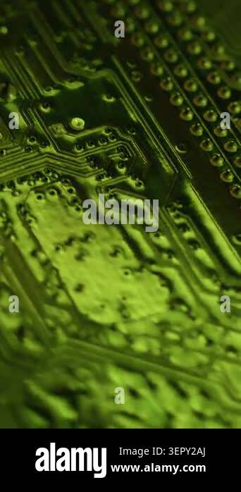 Vertical video. Mainboard chip. Cpu abstraction. Blur green color ...