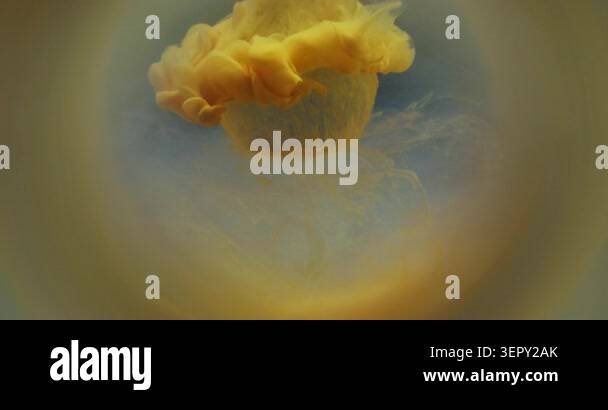 Ink shot. Mist paint. Yellow pigment dripping color water blur vapor ...