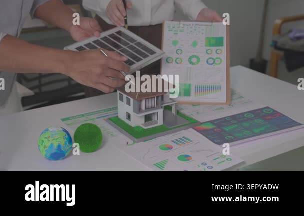 Business people discussing sustainable housing development and ESG ...