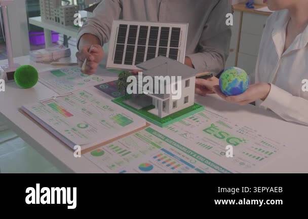Business people discussing sustainable housing development and ESG ...