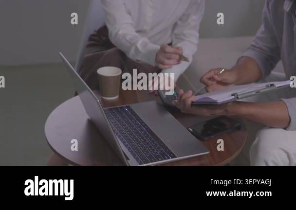 Client pointing at document during business contract signing meeting ...