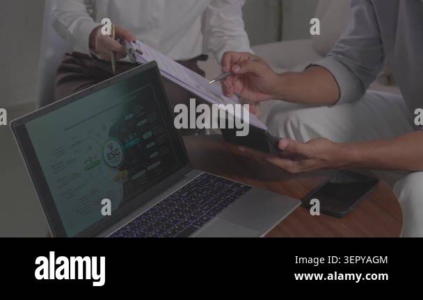 Client pointing at document during business contract signing meeting ...