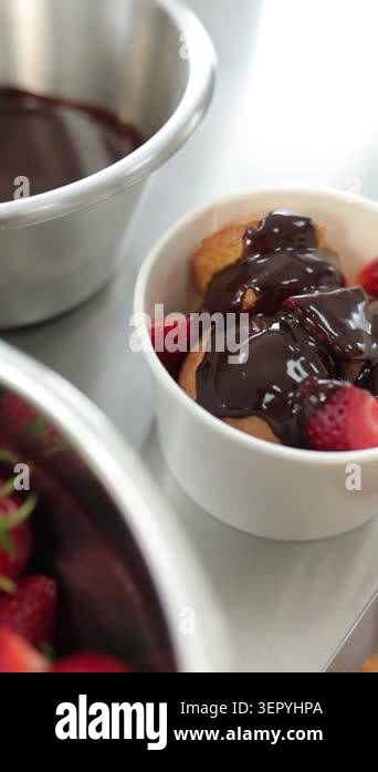 Freshly baked cream puff pastries cream in a paper bucket Stock Video ...