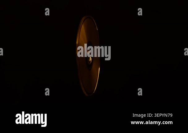 Rainbow light reflecting of a surface of a rotating CD-DVD disk against ...