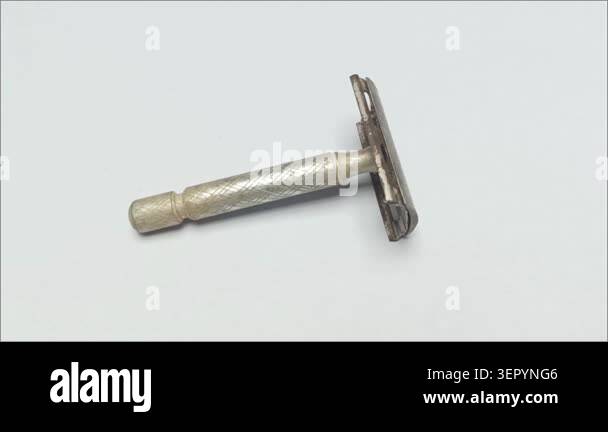 Classic metal safety razor fully assembled with textured knurled handle ...