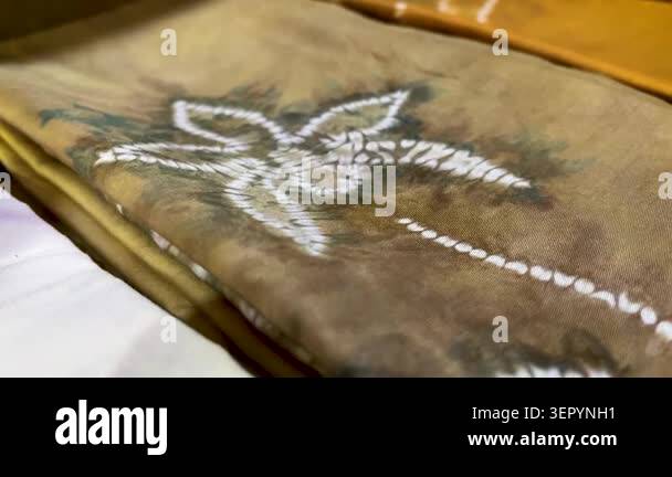 Collection of Colorful Folded Traditional Resist Dyed Fabric Displayed ...