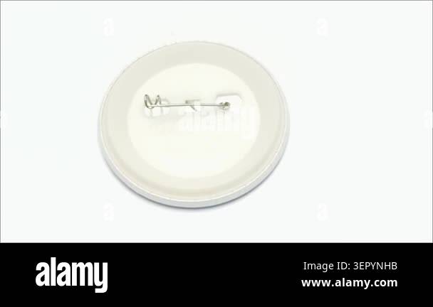 Plastic backing of a round pin button badge with metal safety pin clasp ...