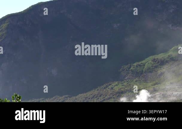 Volcanic landscape with steaming fumaroles on the slopes of mount ...