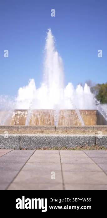 Water fountain spraying water into clear sky Stock Video Footage - Alamy