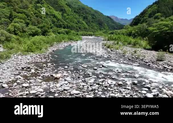 Clear river flowing through green mountainous landscape Stock Video ...