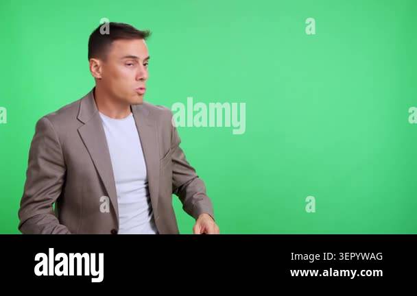 Amazed man pointing to the side with different expressions against a ...