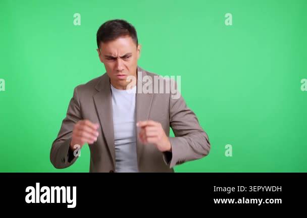 Stressed businessman closing his ears to ignore an annoying and ...