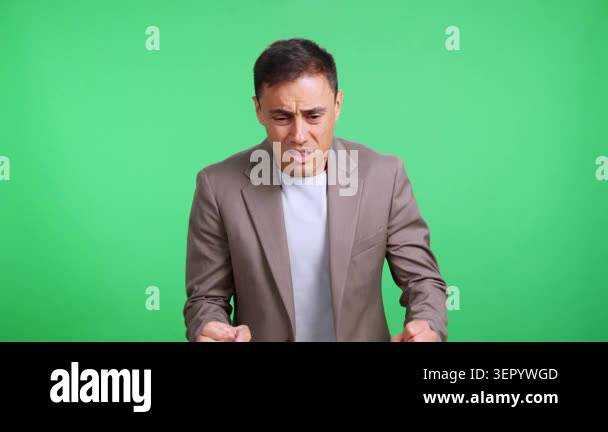 Anxious and angry man feeling overwhelmed and frustrated against a ...