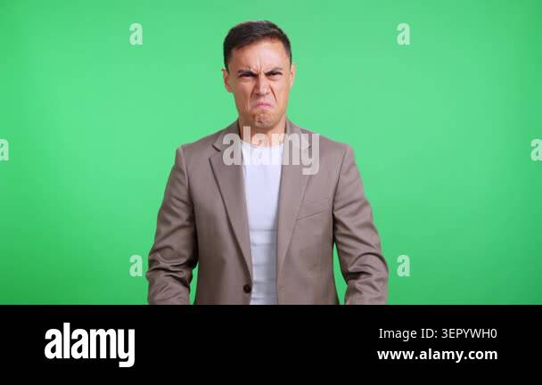 Mature man with a puzzled expression scratching his head in confusion ...