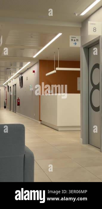 Madrid, Spain, June 9-2026: Modern hospital corridor with clean white ...