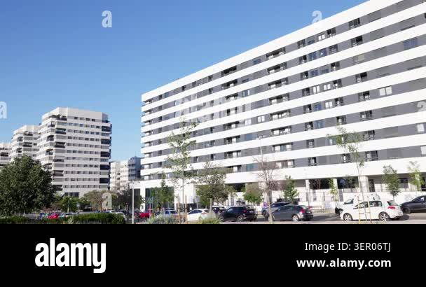 Horizontal 4K footage of contemporary white and gray high-rise ...