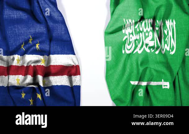 waving colorful flag of saudi arabia and national flag of cape verde ...