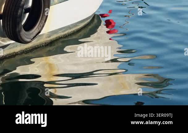 A cinematic close up of a calm sea water surface capturing vibrant and ...