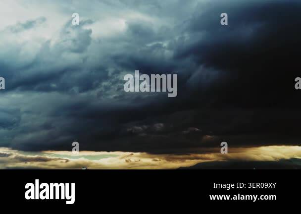 Soft rain clouds moving across the sky in timelapse, showing gentle ...