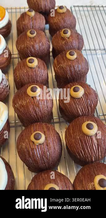 Flaky layered pastry with delicate beige cream and a chocolate circle ...