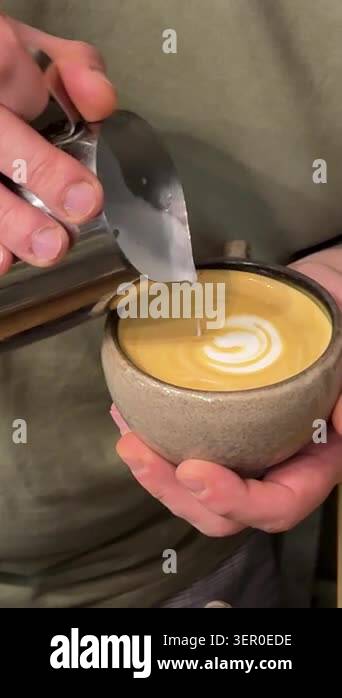 Fresh coffee prepared in stylish cafe with espresso machine creamy milk ...