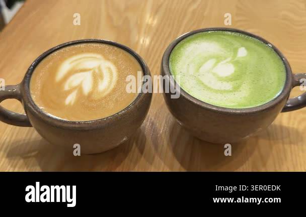 Two elegant drinks in gray ceramic cups with green matcha latte and ...
