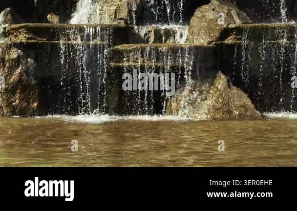 Scenic high-angle view looking down on a cascading waterfall from wet ...