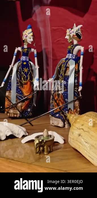 Elegant incense smoke rising from golden elephant incense holder with ...