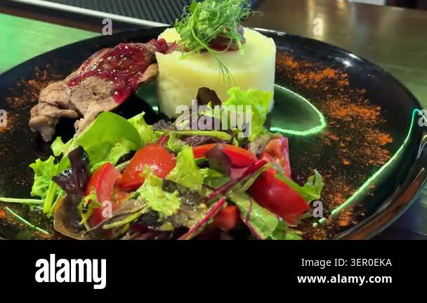 Crispy duck leg served with cranberry sauce, creamy mashed potatoes and ...