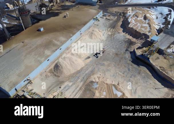 Aerial view of an active timber production facility where heavy ...