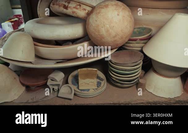 High quality close up shot of unfired terracotta clay bowls and dishes ...