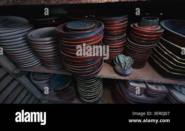 High quality close up shot of unfired terracotta clay bowls and dishes ...