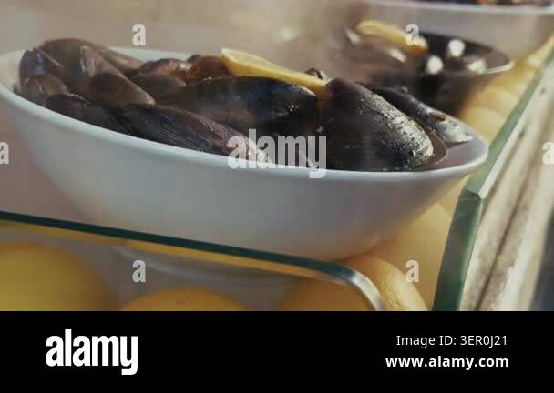 Traditional Turkish street food featuring hot stuffed mussels, freshly ...