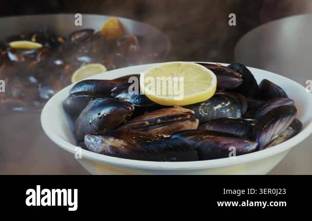 Traditional Turkish street food featuring hot stuffed mussels, freshly ...