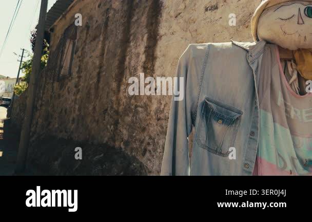 High resolution cinematic shot of a unique handmade cloth puppet in ...