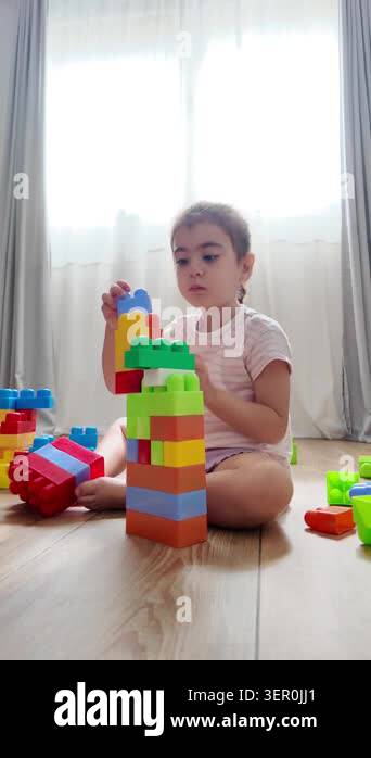 Toddler Girl Playing with Colorful Building Blocks at Home Stock Video ...