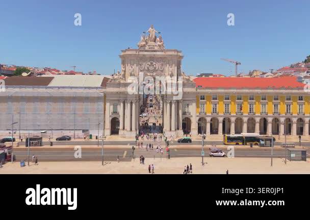 Lisbon City on Sunny Day. Commerce Plaza, Tourists and Rua Augusta Arch ...