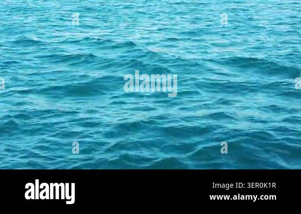 a boat sailing on the blue sea, gently choppy waters Stock Video ...