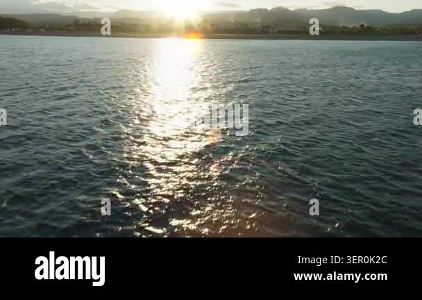 Sunset in Calabria on the calm and peaceful Mediterranean Sea Stock ...