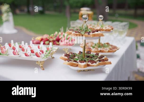 Elegant catering buffet table with gourmet appetizers and drinks ...