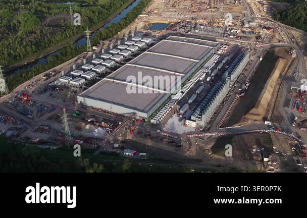 Aerial view of a large hyperscale datacenter facility being built, a ...
