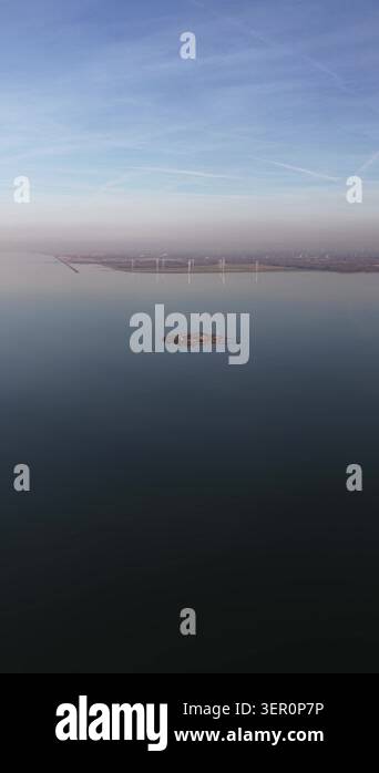 Breathtaking aerial footage capturing a large cargo ship navigating ...