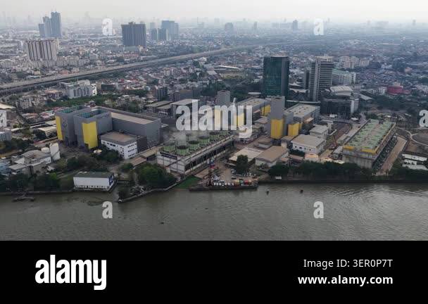 Aerial footage showing a large power plant on the chao phraya river ...