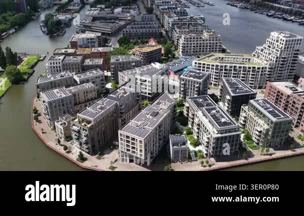High angle aerial footage capturing a modern residential area featuring ...