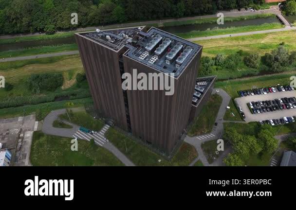 Drone perspective flying around a large, contemporary data center with ...