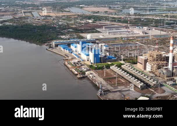 Expansive aerial footage showcasing a large industrial power plant ...