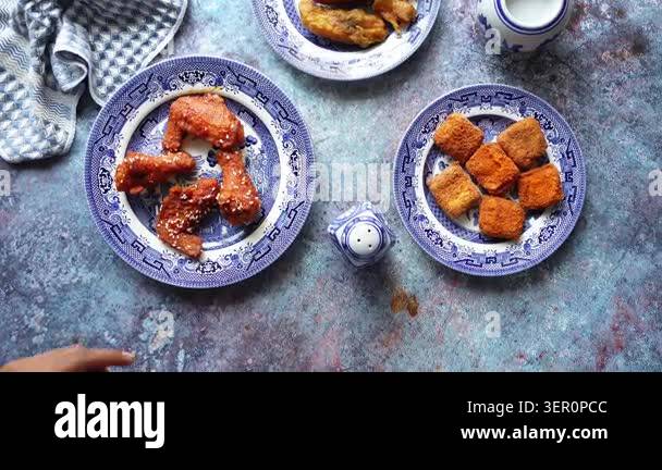 Delight in seeing different fried snacks served on blue plates Stock ...