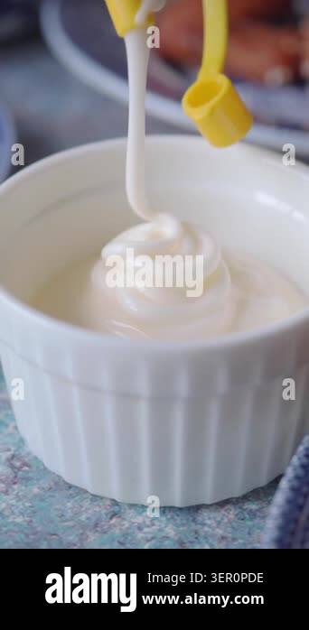 Creamy White Mayonnaise Being Squeezed into a Ramekin Stock Video ...