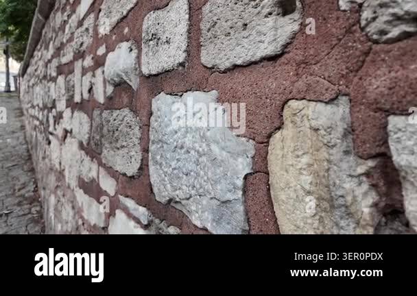 Close look at stone wall showing different textures and colors along ...